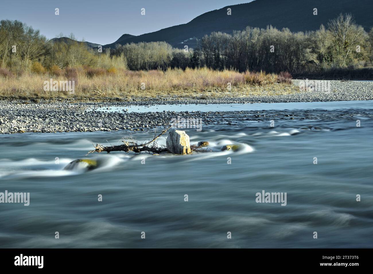 River current and bank with boulders Stock Photo - Alamy
