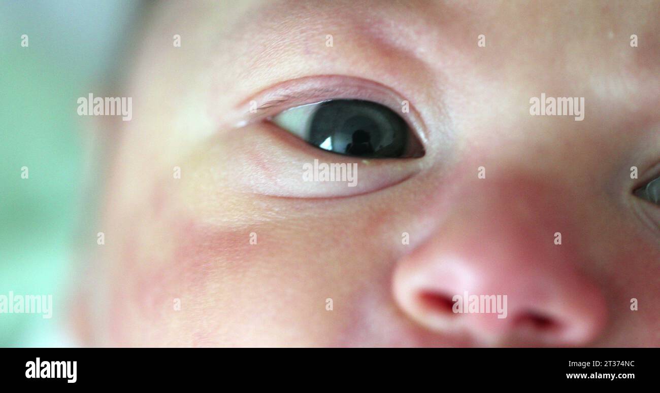 Newborn baby first day of life face Stock Photo - Alamy