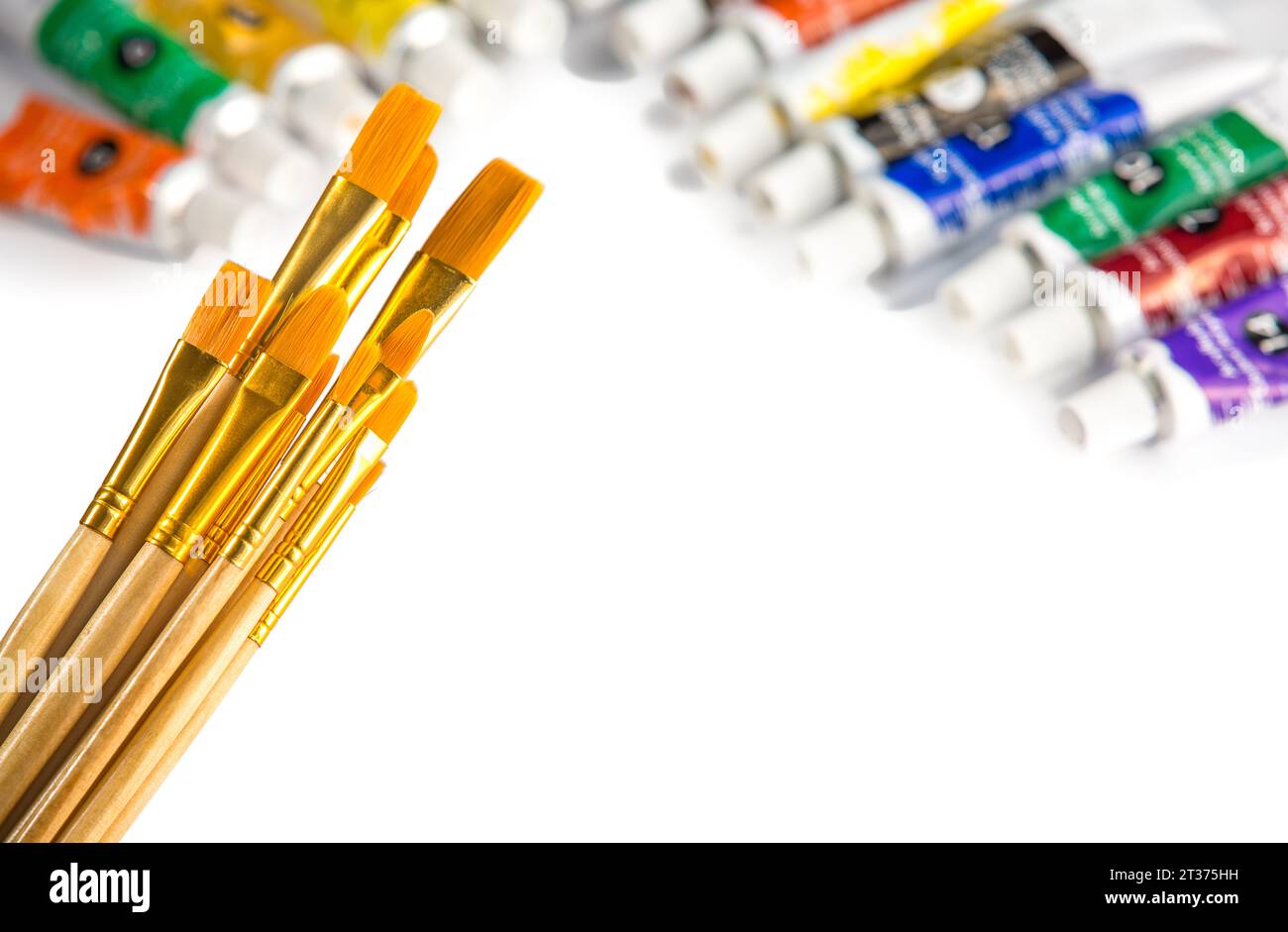Clean new assorted sized brushes and acrylics, artist palette, against ...