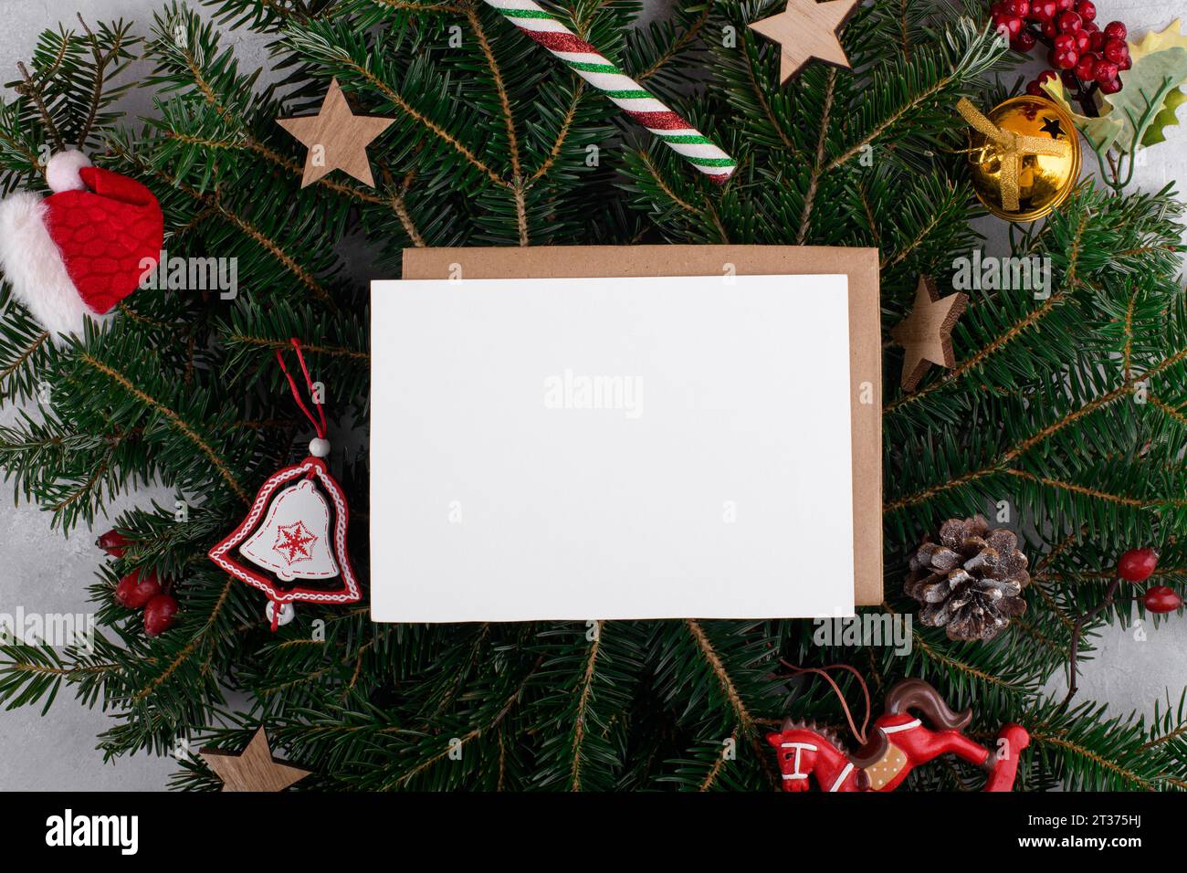 Christmas 5x7 card mockup template with envelop on natural fir twigs ...