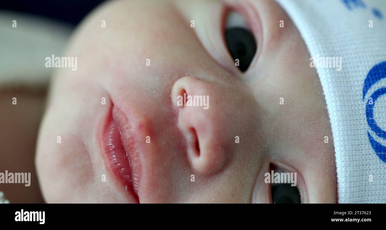 Newborn baby face close-up details of eyes nose and mouth in first ...