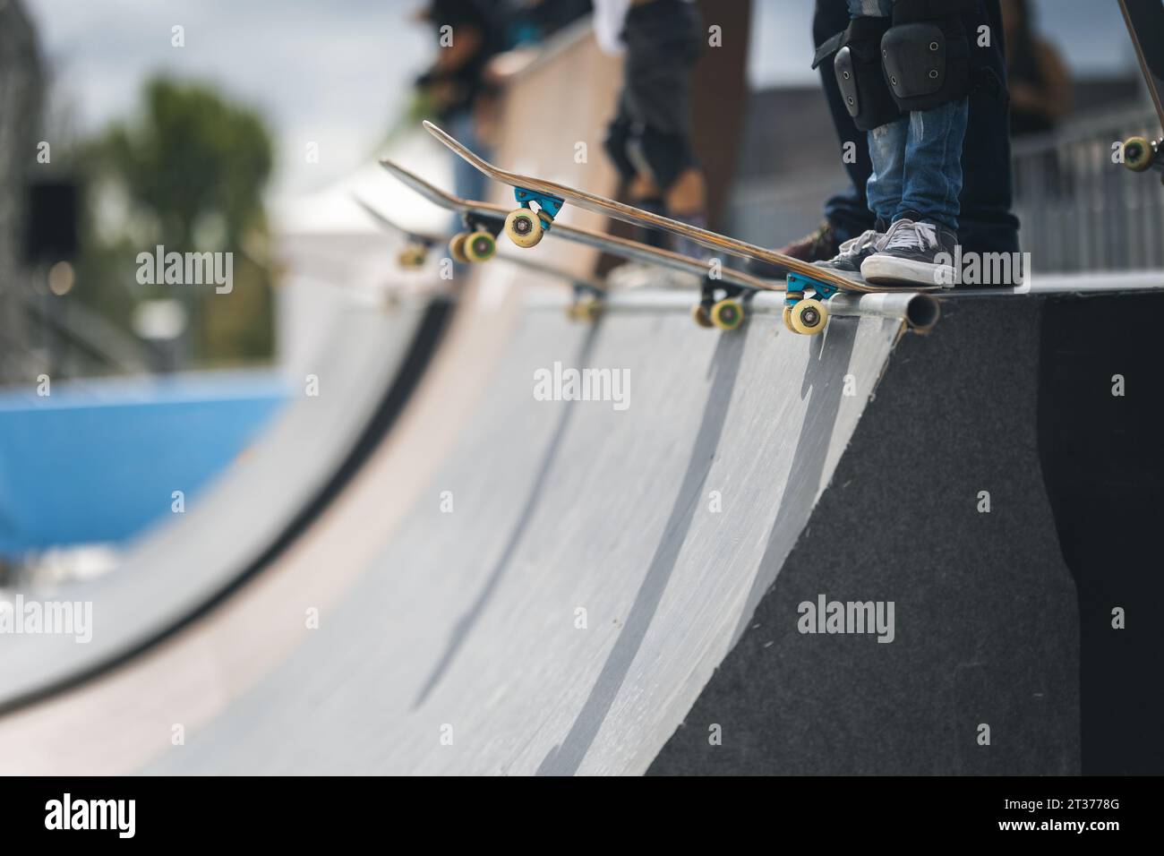 Skater sliding down a metal rail Stock Photo - Alamy