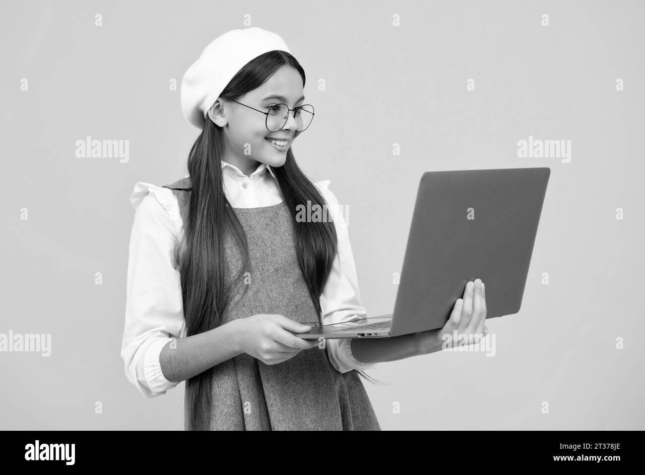 School student using laptop. E-learning and online education. Teen girl ...