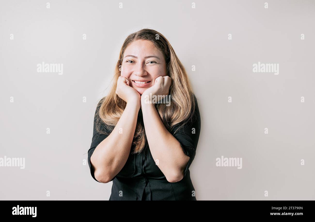 Latin American girl face looking and smiling at the camera. Portrait of ...