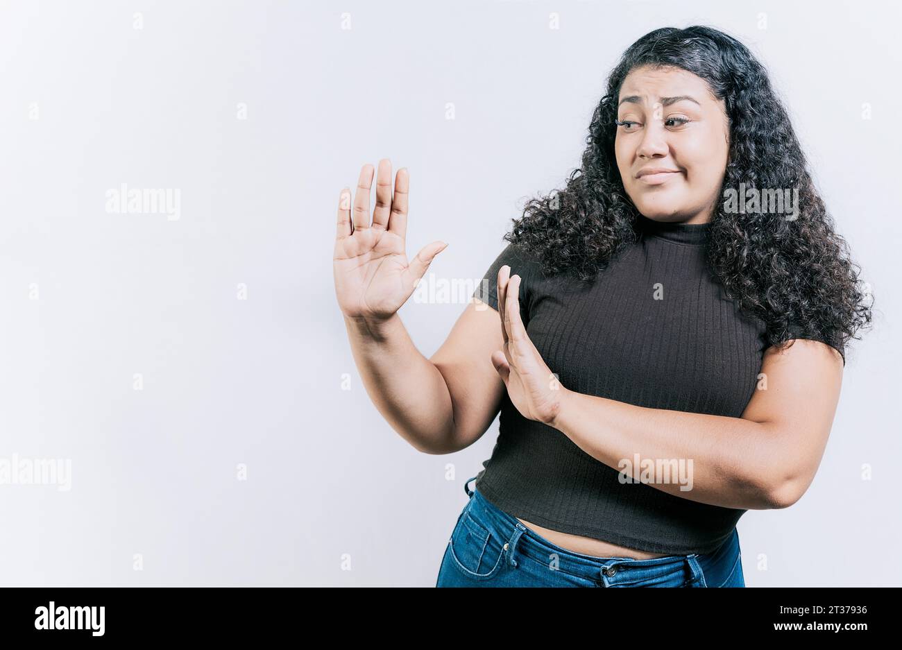 Displeased young woman rejecting with palms hands isolated. Disgusted ...