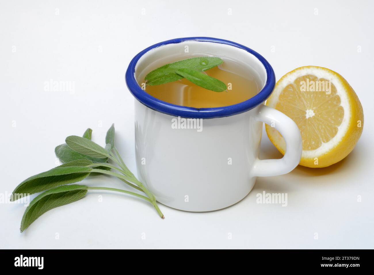 Sage tea in cup, sage leaves and lemon Stock Photo - Alamy
