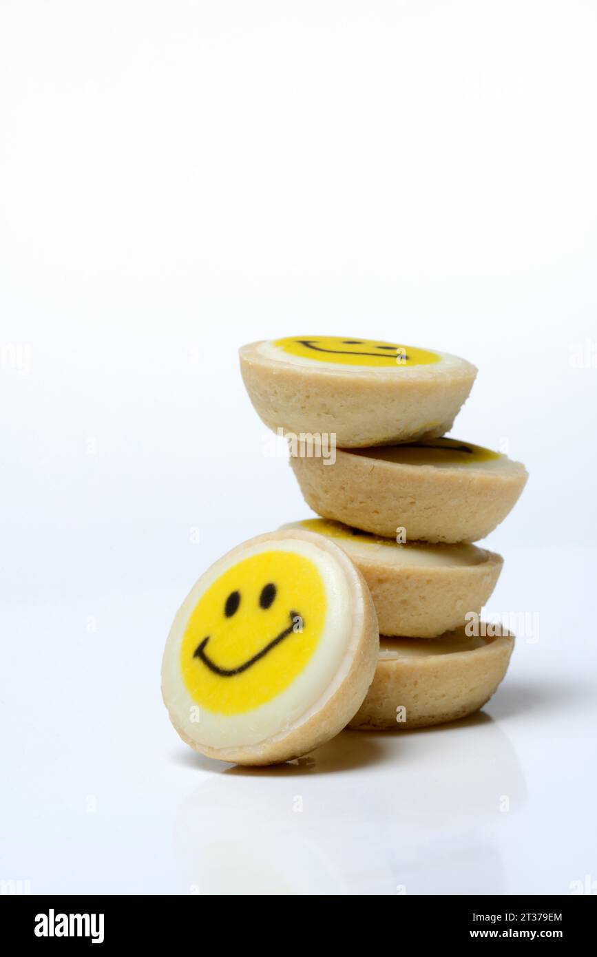 Pastry with smiley face, symbol Stock Photo - Alamy