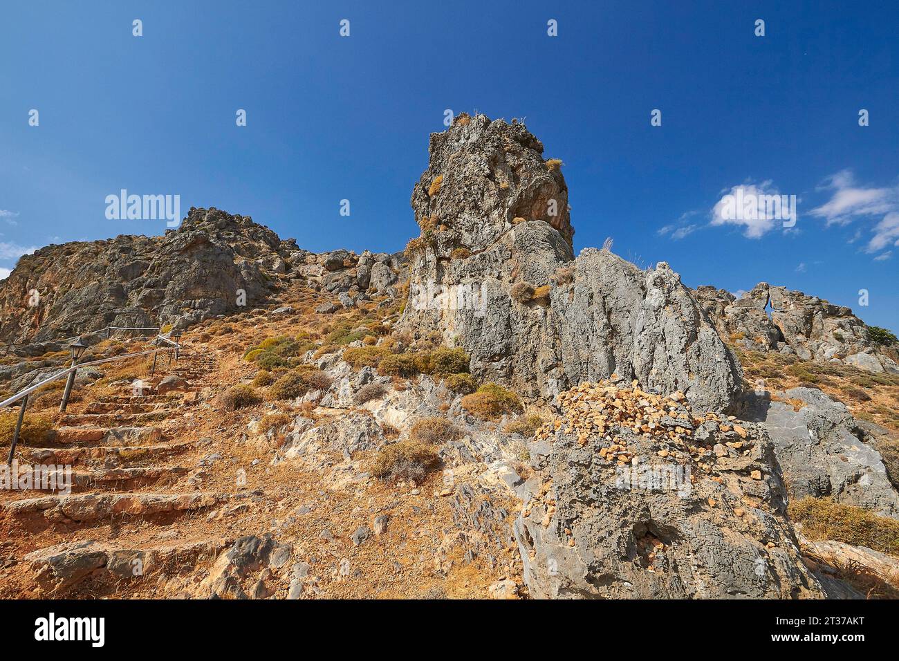 Stone steps, rocky crags, cave, blue sky, white clouds, Kapsa, Orthodox ...