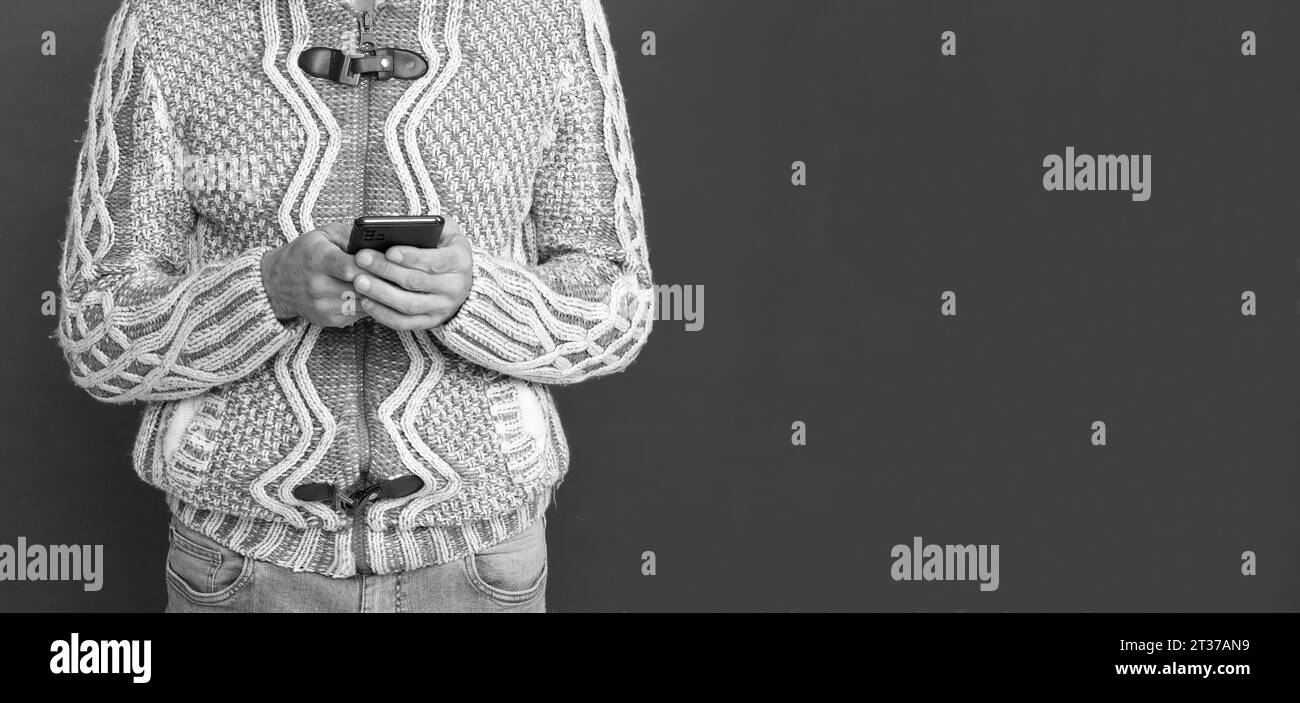 smiling male fashion model hold smartphone. concept of modern ...