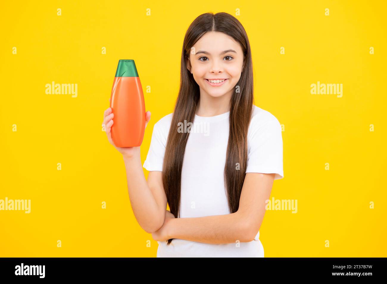Teenage girl with shampoos conditioners or shower gel. Kids hair care ...