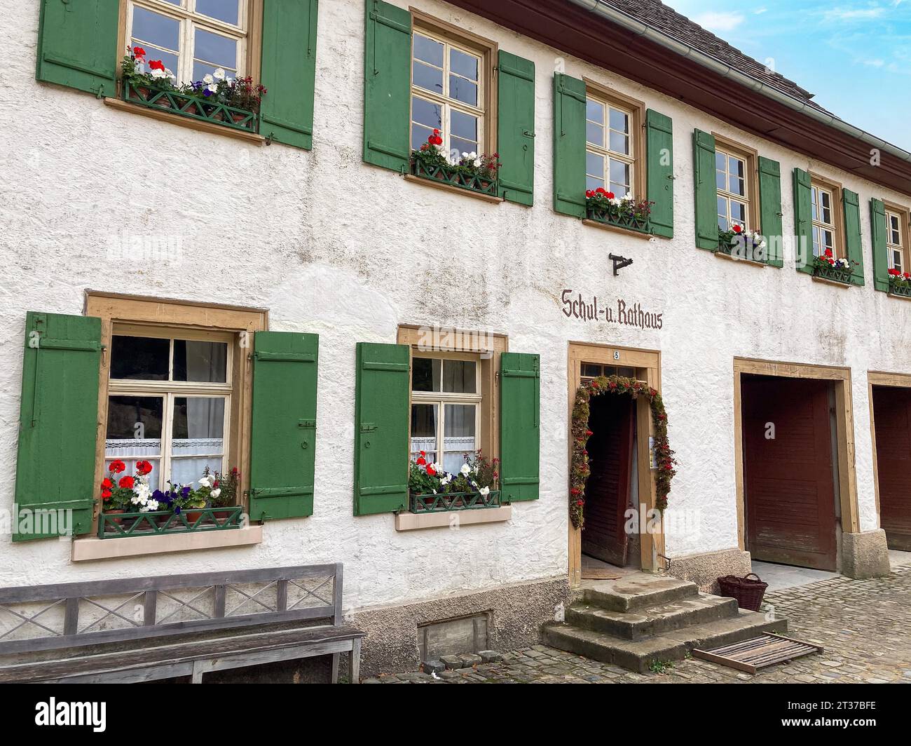 Historic schoolhouse of Bubsheim from 1830 with green shutters rebuilt ...