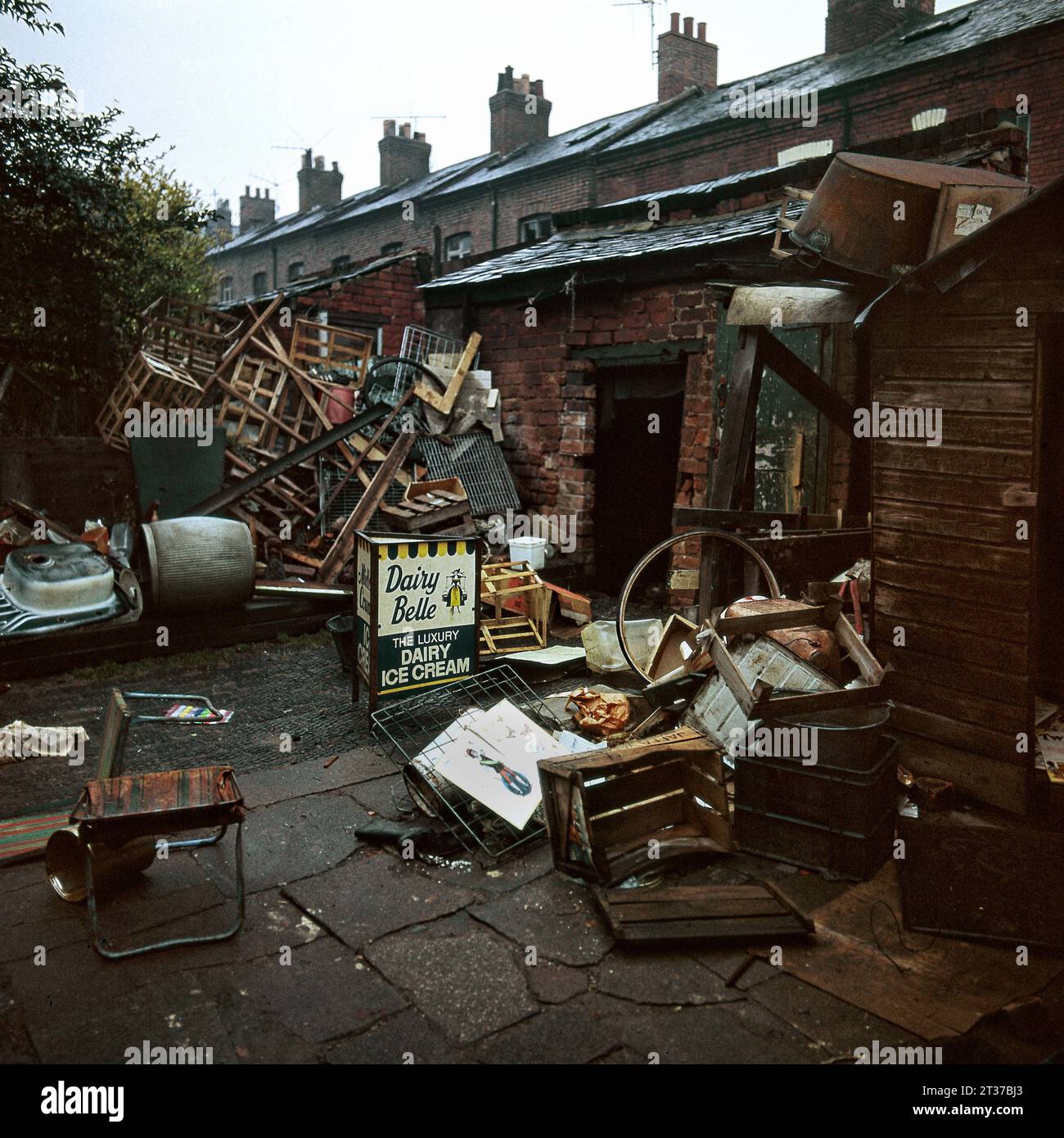 Discarded items including a dolly tub & tin bath in the backyard of a ...