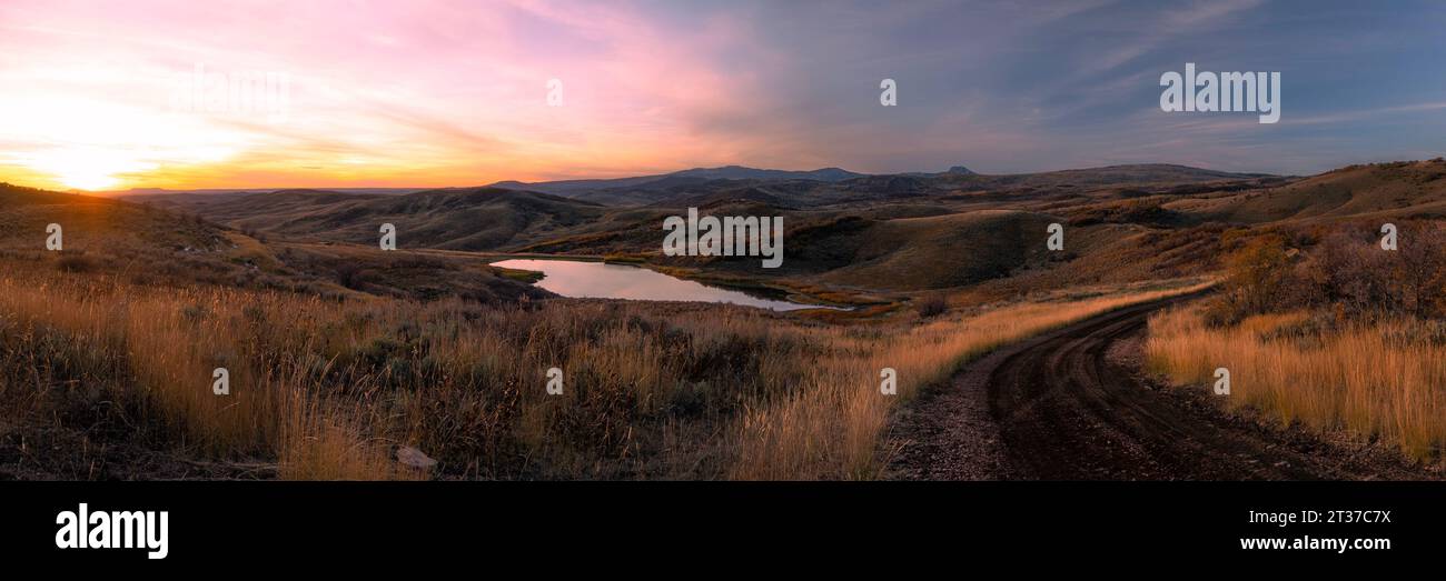 A 1x3 panorama of the backcountry north of Hayden, CO. A winding road ...