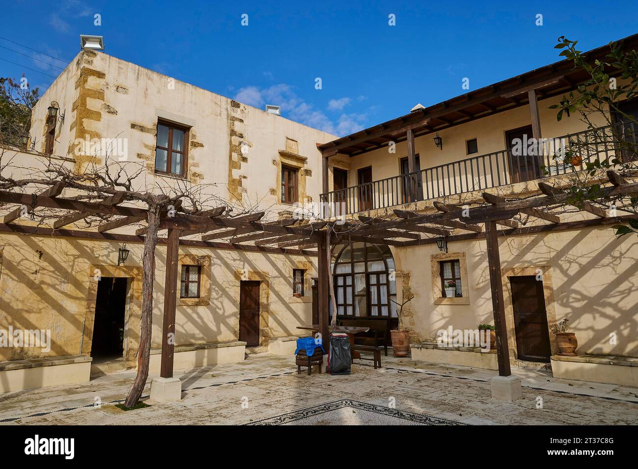 Inner courtyard, grape arbours, building over corner, Panagias ...