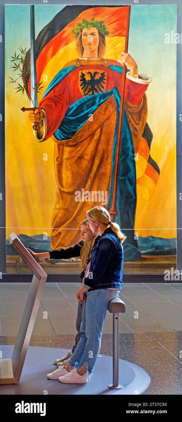 Two woman at a screen in front of the painting of Germania by Philipp ...