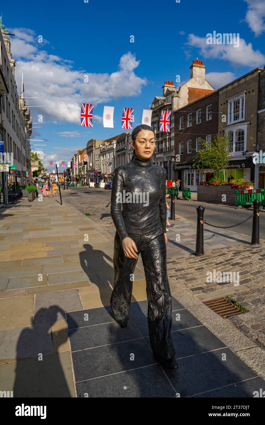 Bronze statue Walking Woman in High St Colchester Essex Stock Photo - Alamy