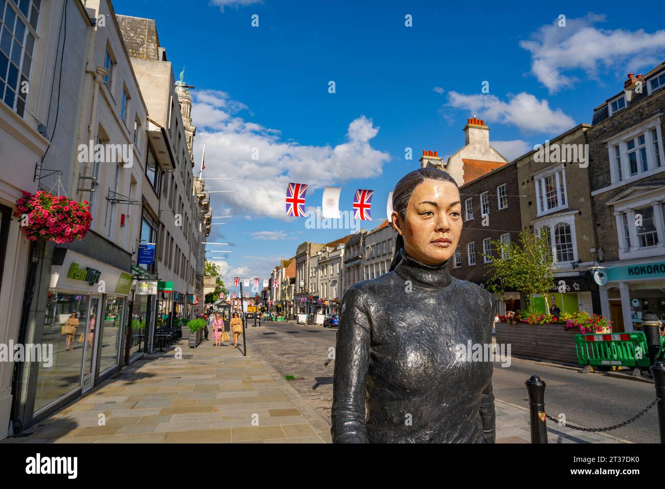 Bronze statue Walking Woman in High St Colchester Essex Stock Photo - Alamy