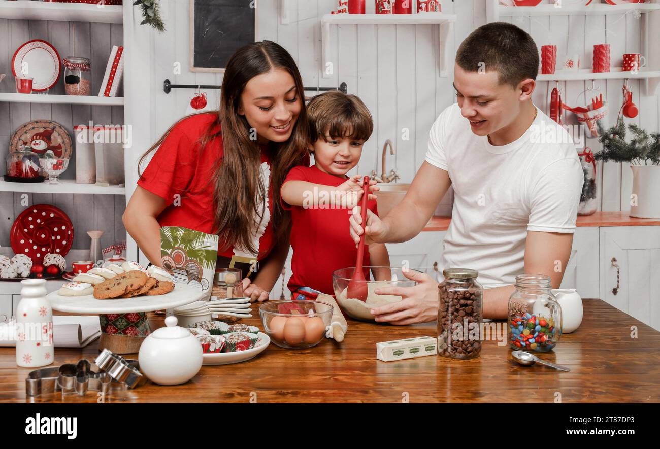 A happy family making cookies in the kitchen for Christmas Stock Photo ...