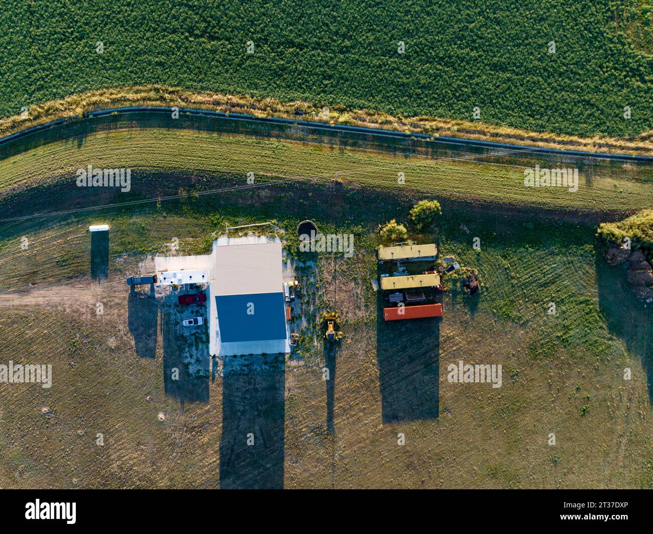 Tiny farmhouse aerial view nest to an alfalfa field. Colorado ...