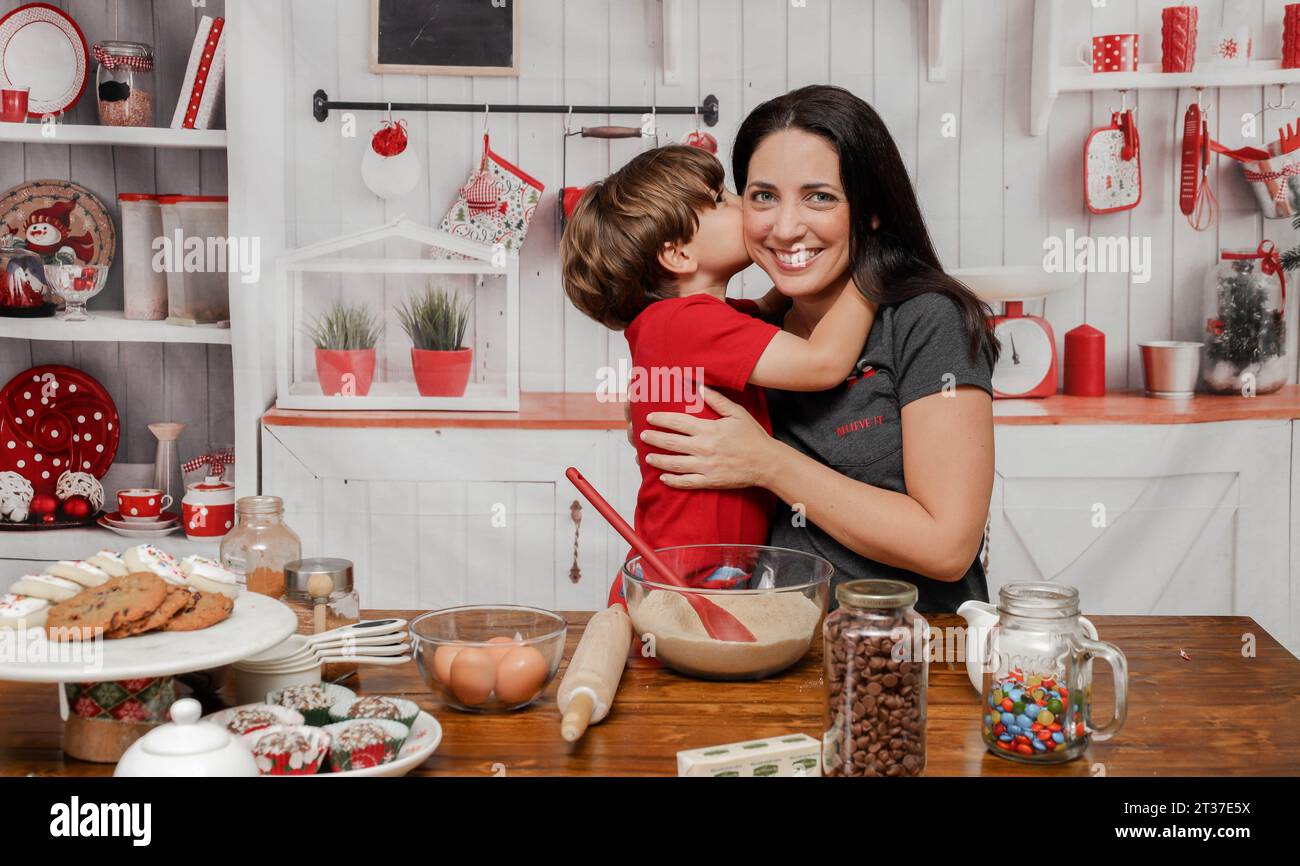 A happy family making cookies in the kitchen for Christmas Stock Photo ...