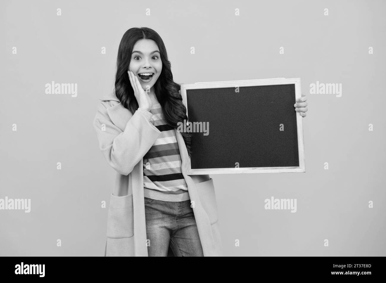 School sales board. Cheerful teenage girl kid hold blackboard ...