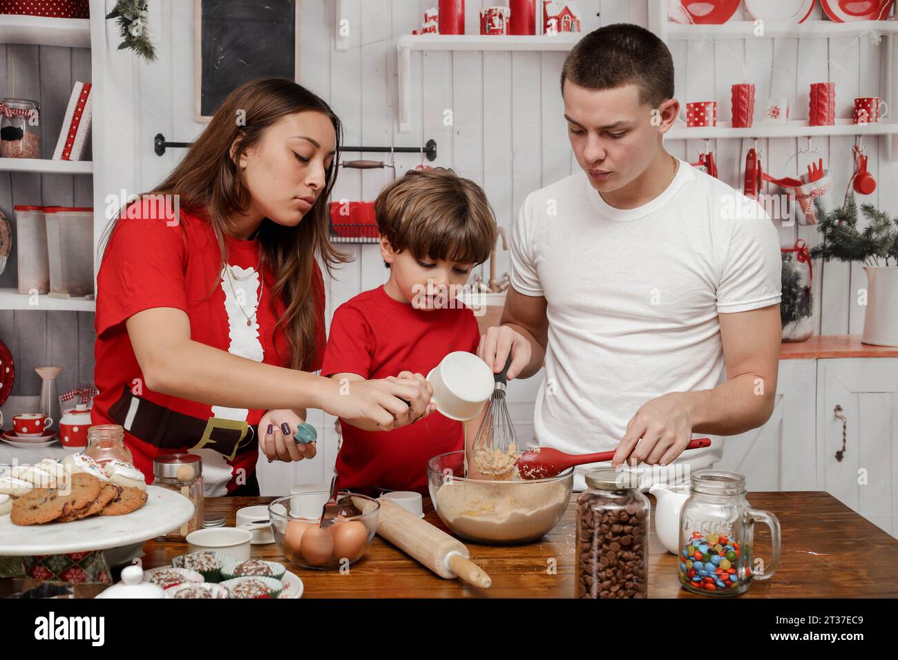 A happy family making cookies in the kitchen for Christmas Stock Photo ...