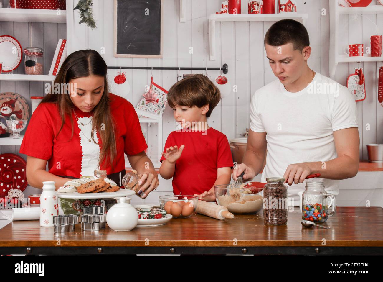 A happy family making cookies in the kitchen for Christmas Stock Photo ...