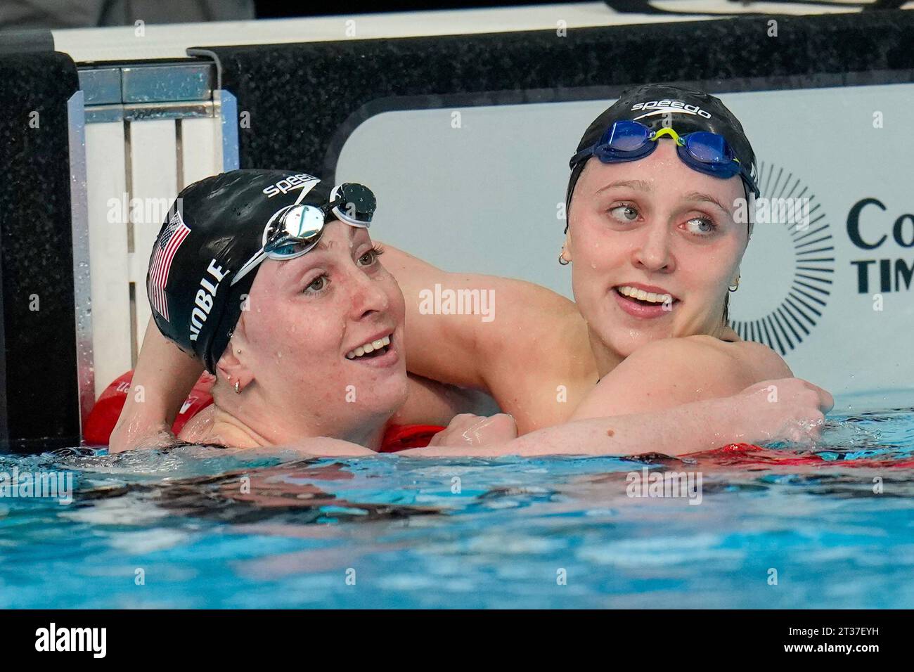 Helen Noble of the United States and embraces teammate Josephine Fuller ...