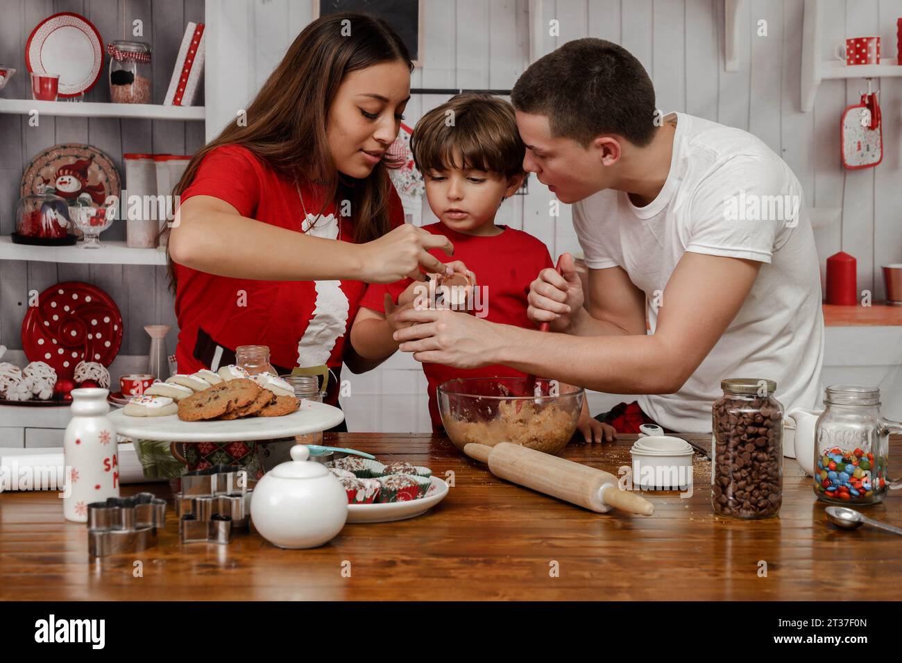A happy family making cookies in the kitchen for Christmas Stock Photo ...