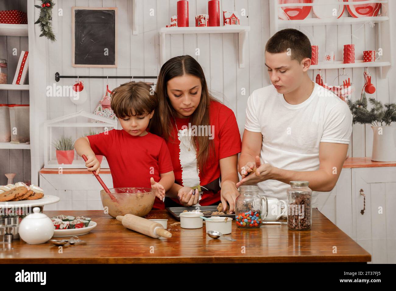 A happy family making cookies in the kitchen for Christmas Stock Photo ...