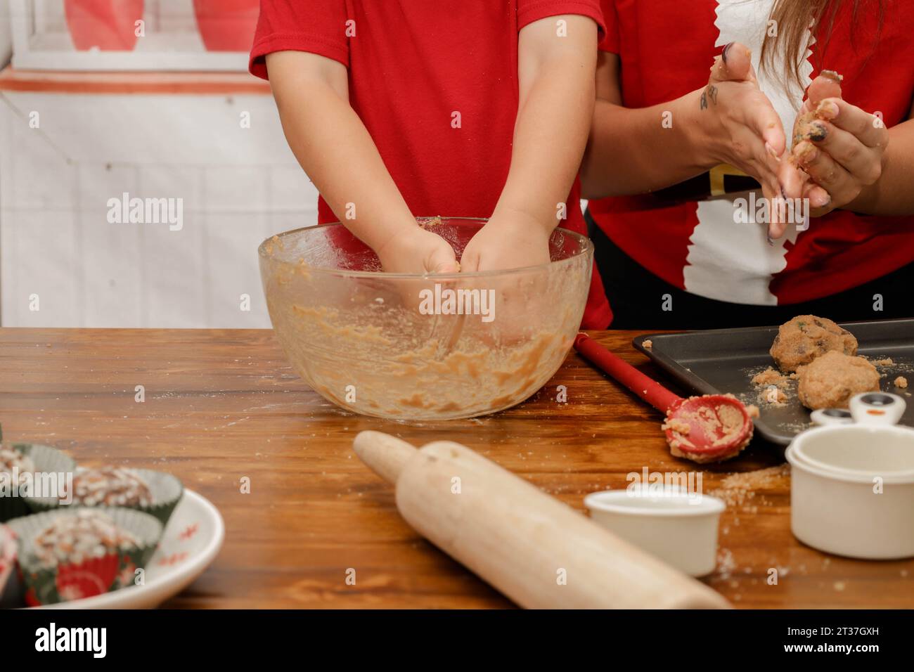 A happy family making cookies in the kitchen for Christmas Stock Photo ...