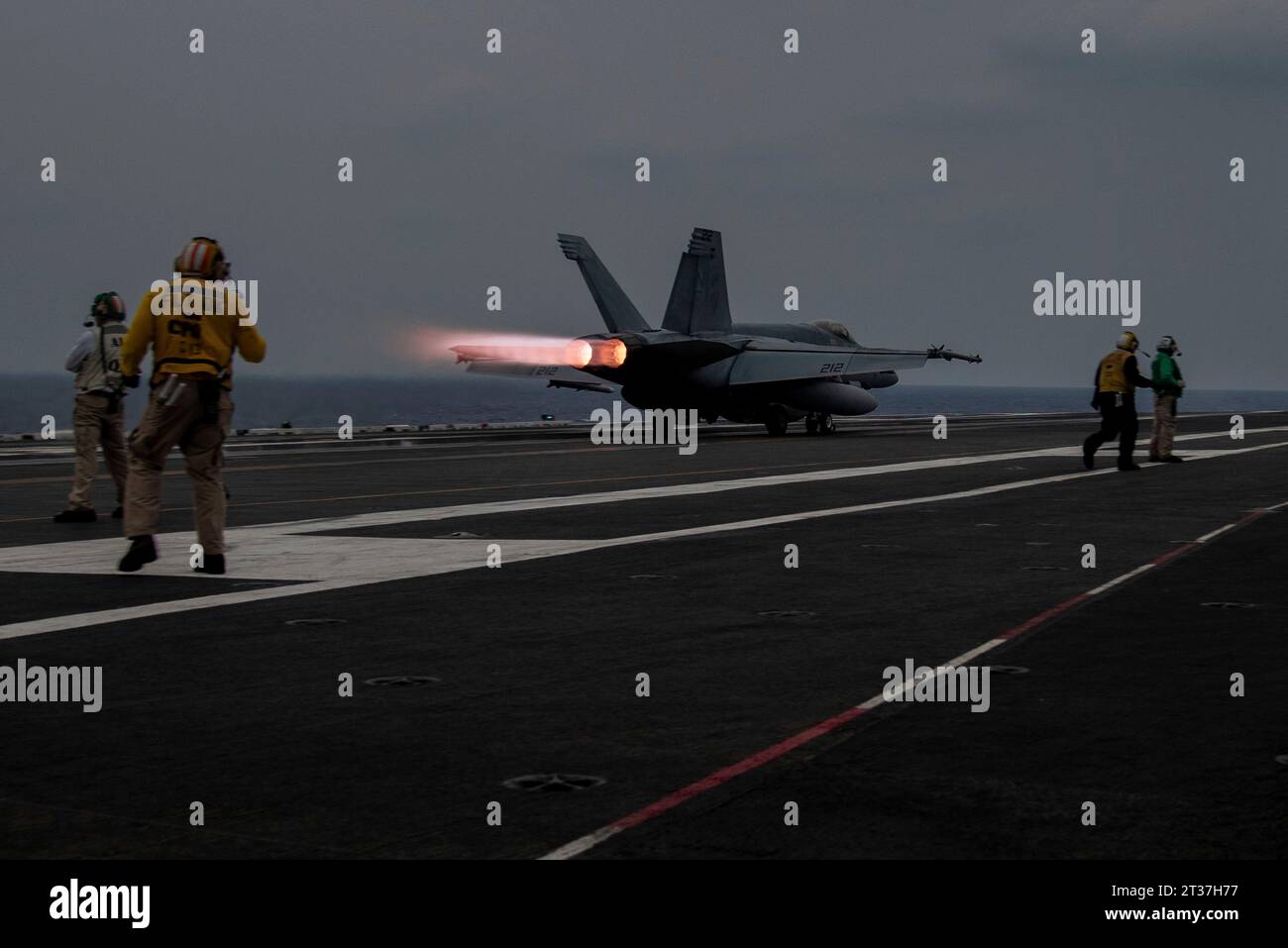 USS Ronald Reagan, Japan. 17 October, 2023. U.S. Navy sailors watch as ...