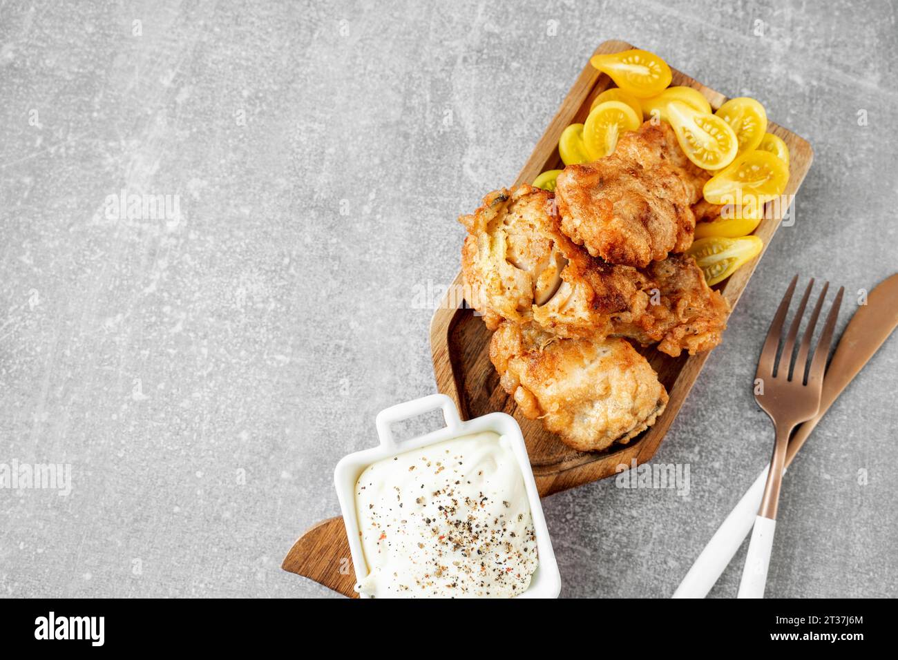 The fish dish is fried cod fillet with a creamy sauce and yellow plum ...