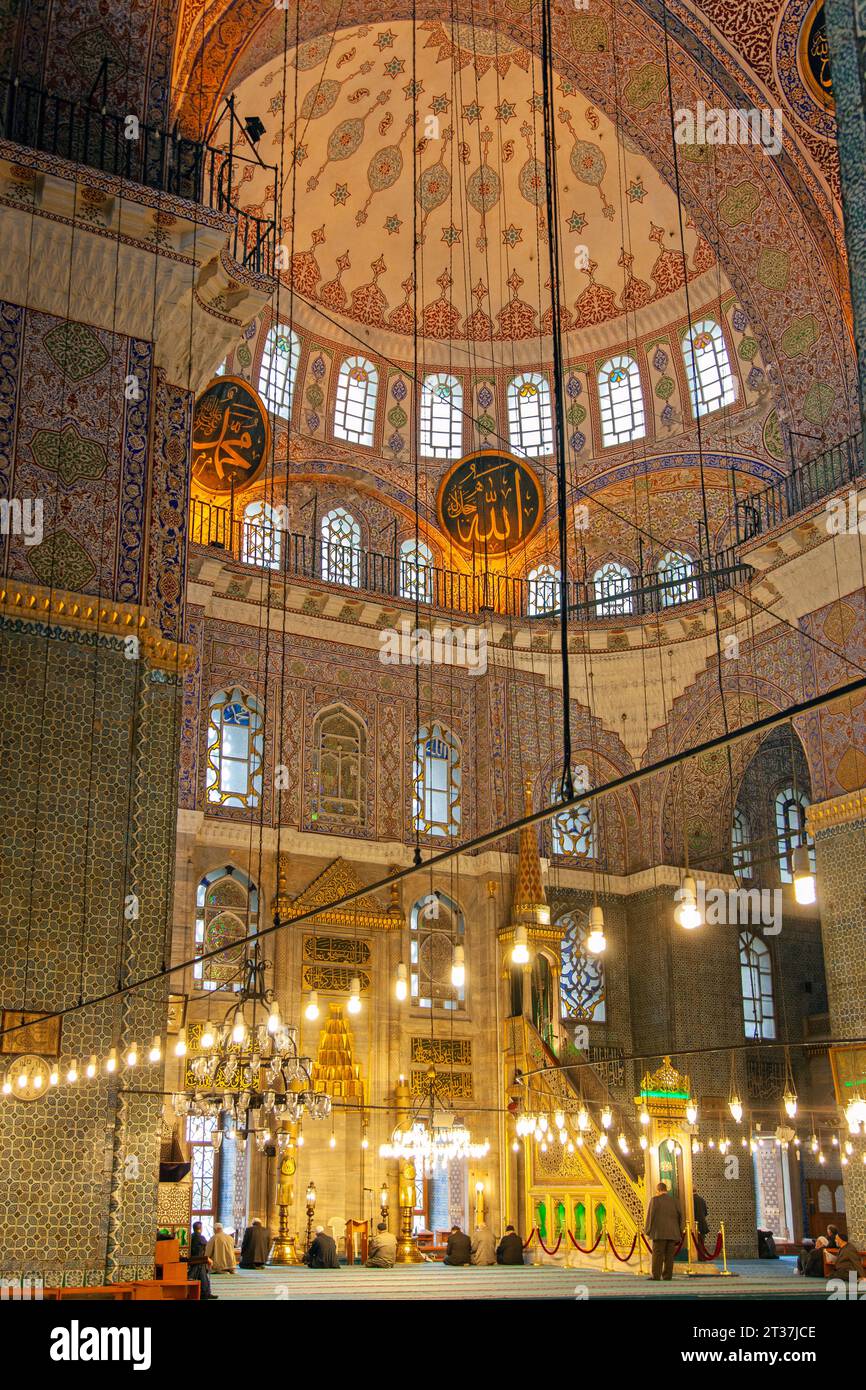 People praying inside the lit up 17th Century Blue Mosque, an Ottoman ...