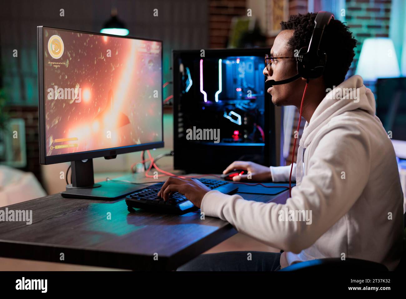 Gamer playing classic arcade spaceship racing videogame, doing flying ...