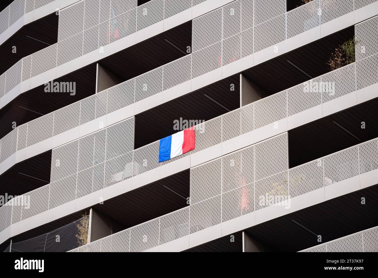 A modern apartment building with a repetitive geometric design features ...