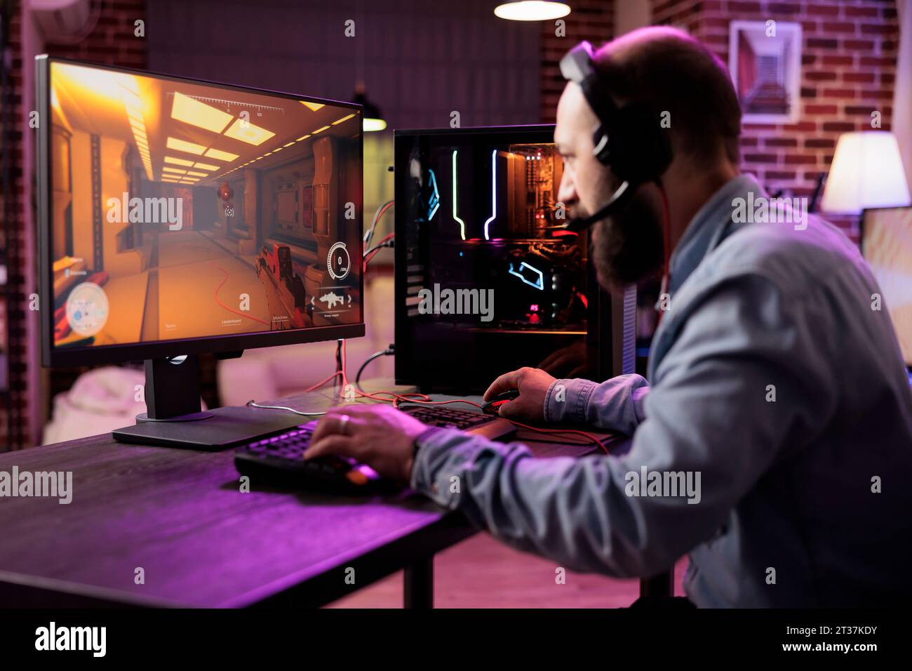 Gamer using expert grade level gaming computer to avoid disruptive lag ...