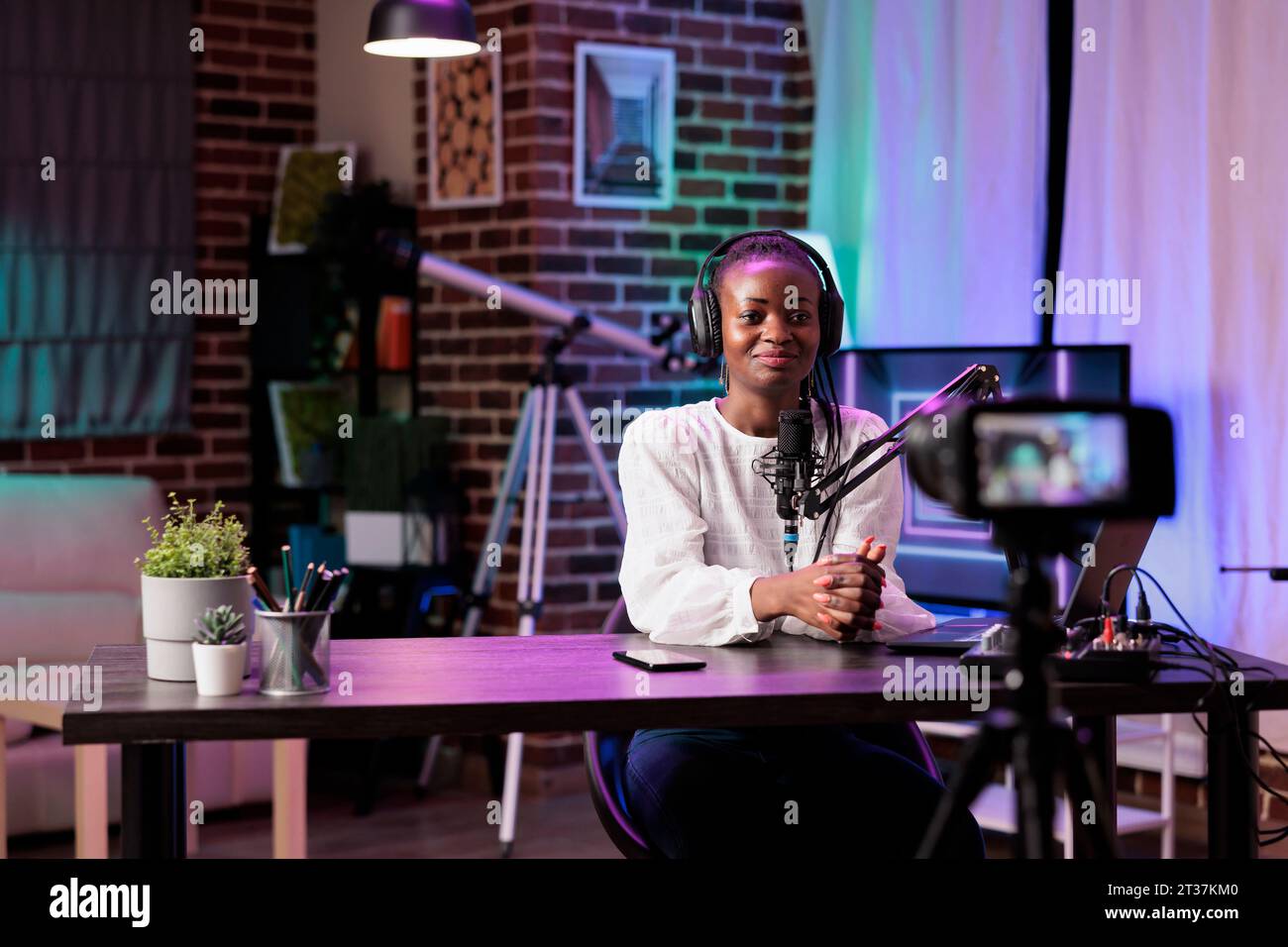 African american vlogger recording internet show using modern camera ...