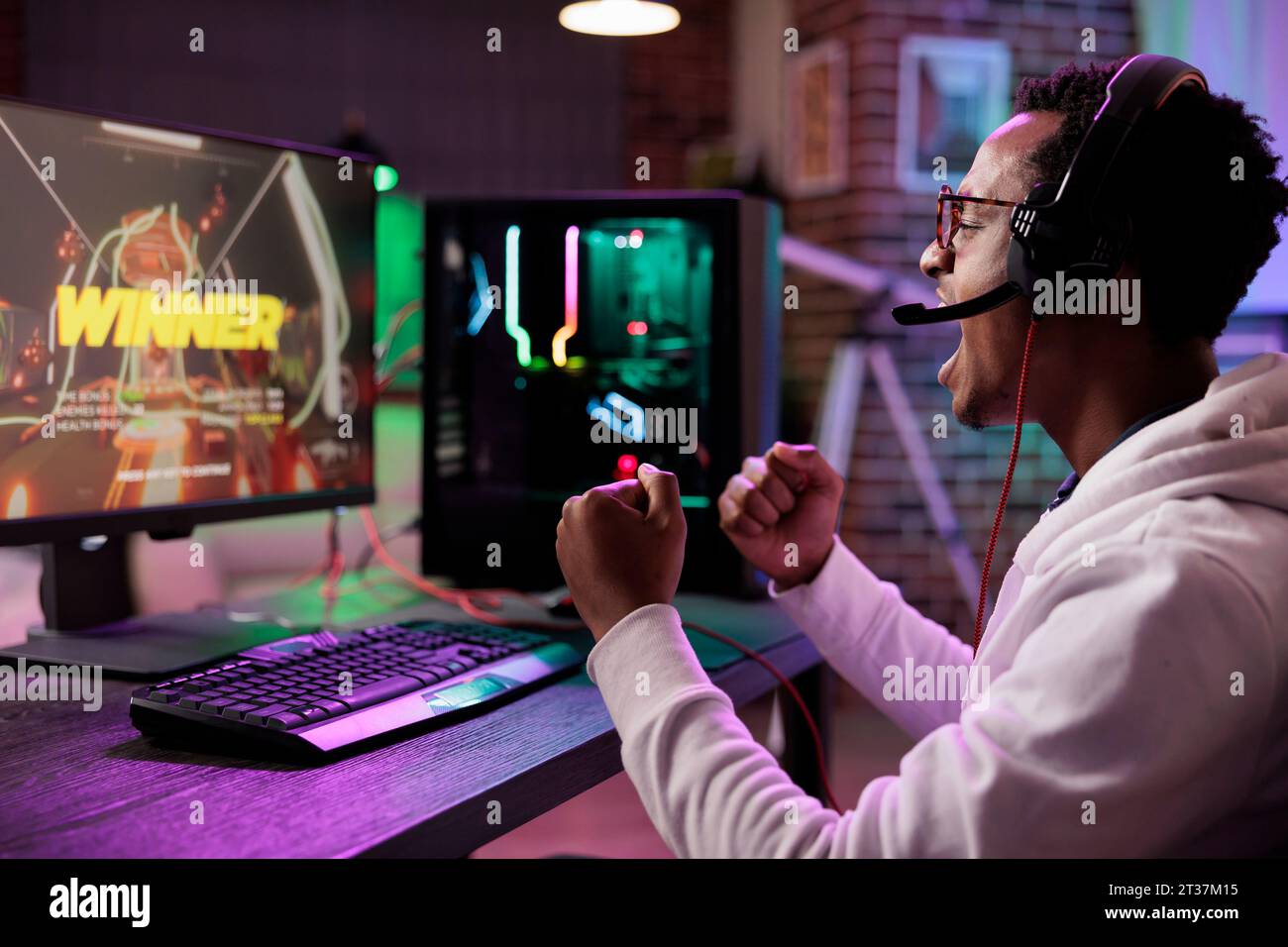 African american gamer cheerful about winning online multiplayer ...