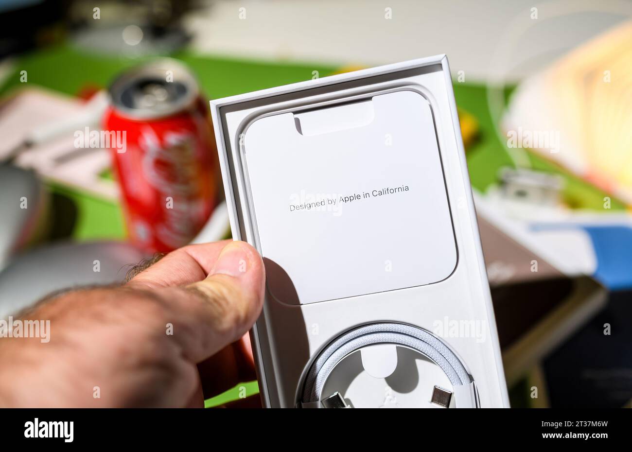London, UK - Sep 28, 2023: A male hand delicately holds the latest ...
