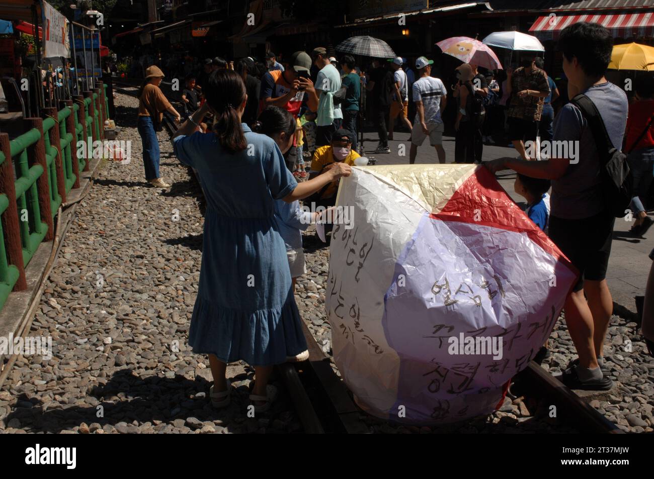 Tourists releasing lanterns into the sky, Shifen Old Street section of ...