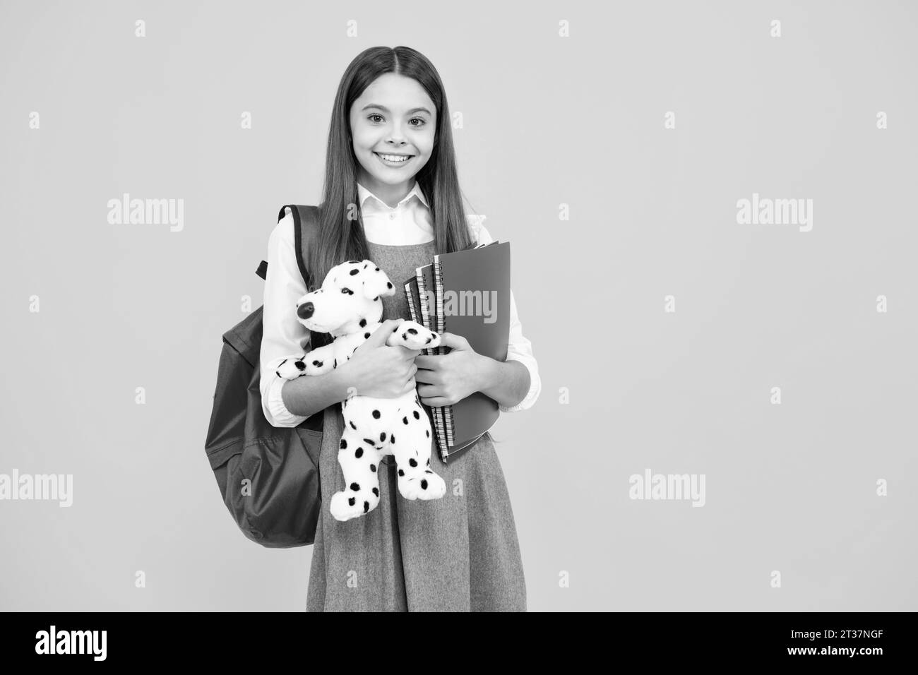 Schoolchild, teenage student girl with toy on isolated studio ...