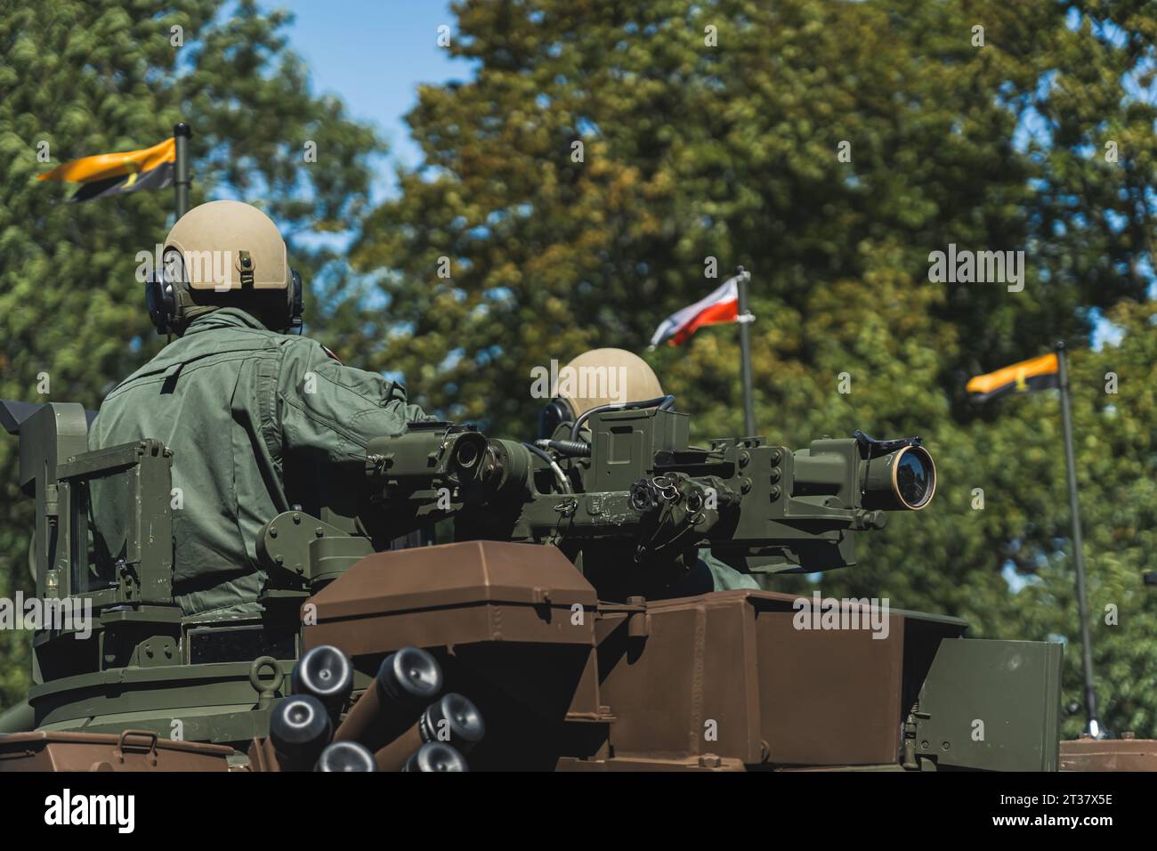 Military mission concept. Two soldiers on a tank against the background ...