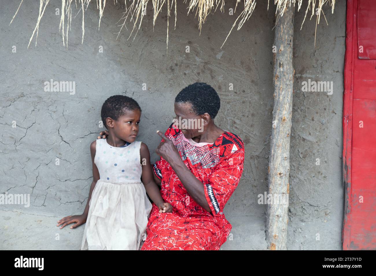 african village granny telling stories to her granddaughter, free ...