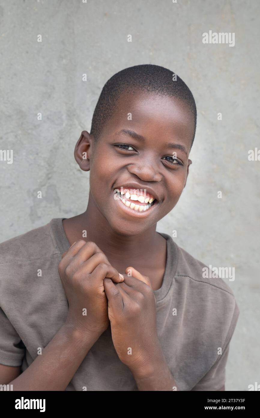 portrait of a happy african village boy, standing in the yard Stock ...