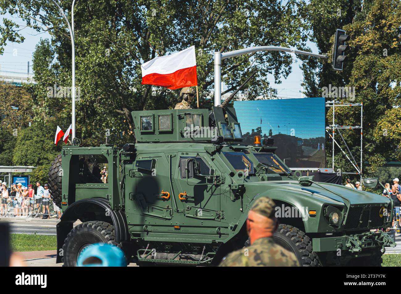 16.08.2023 Warsaw, Poland. Polish Armed Forces Day parade. Green military vehicle with soldiers ...