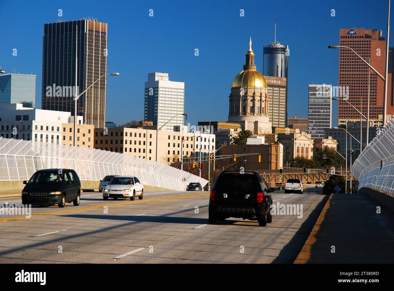 Cars commute to the downtown business district of Atlanta, with the ...