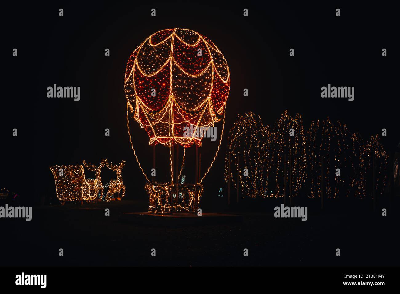 sparkling figure in the dark.Christmas street installation of shining ...