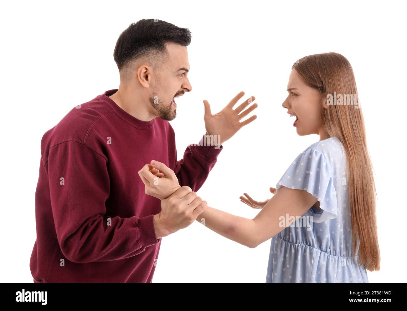 Angry young couple shouting on white background. Domestic violence ...