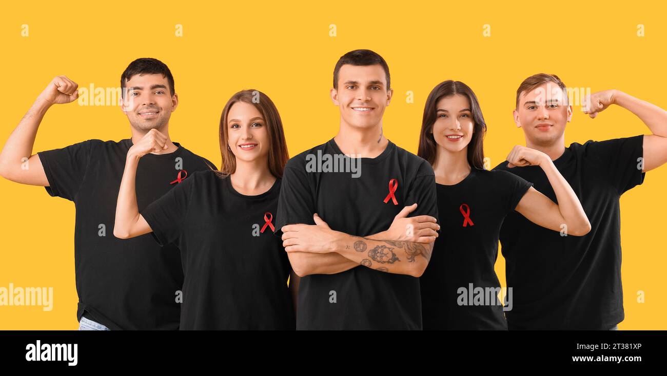 Group of people with red ribbons on yellow background. World AIDS Day ...